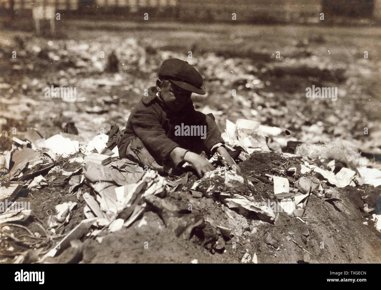 Photograph of a young scavenger going through the Trash on Pleasant ...