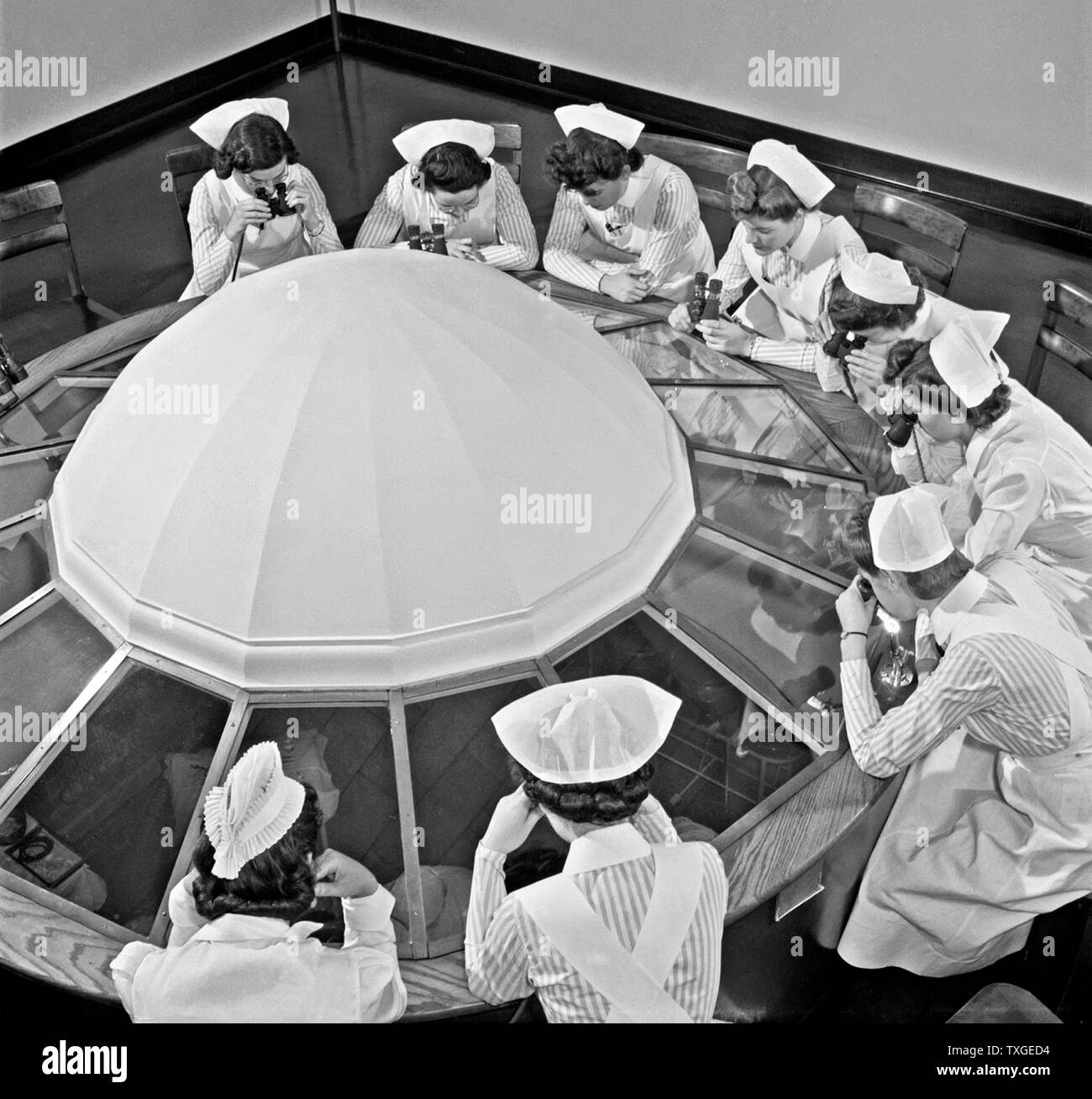 Photograph of student nurses observing an operation. Dated 1942 Stock ...