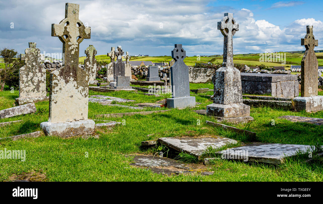 Tombs in ruins of the graveyard of the medieval church of Killilagh in ...