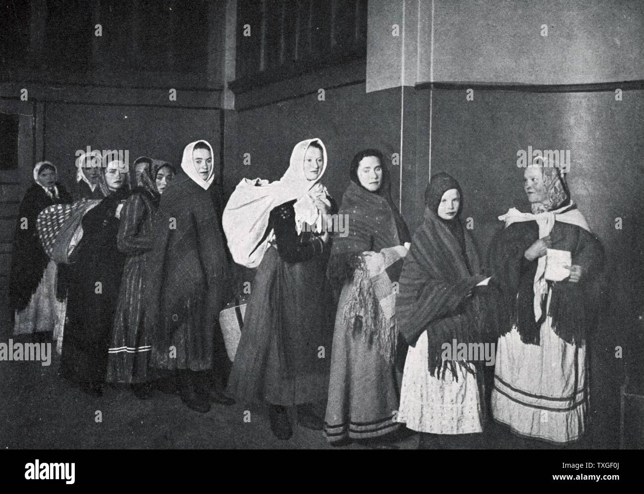 Immigrants arrive at US customs at Ellis Island, New York USA 1910 ...