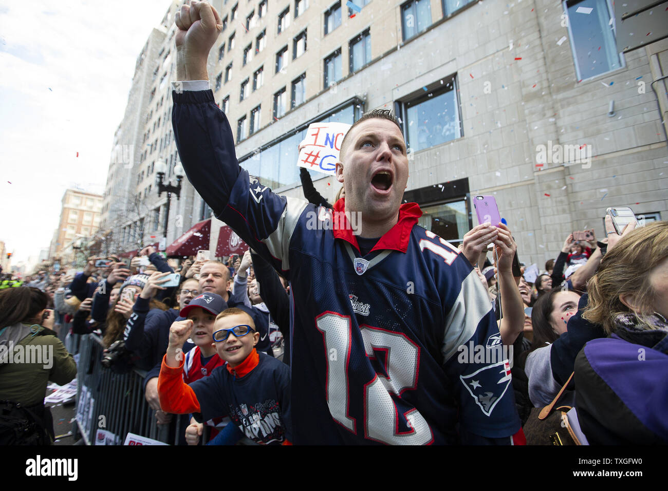 New England Patriots fans cheer on their team as they celebrate winning ...