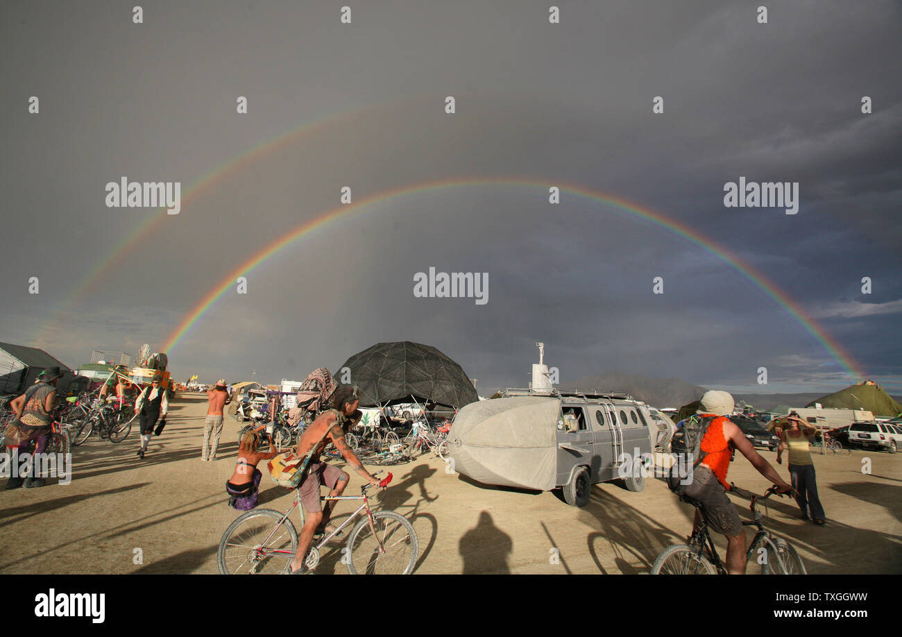 A double rainbow arches over the camp at Burning Man in Black Rock City ...