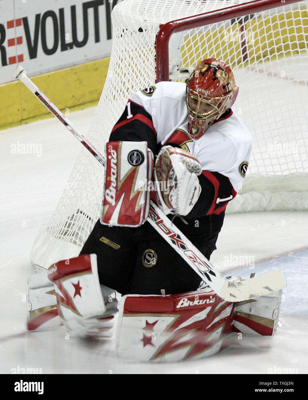 Ottawa Senators goalie Ray Emery of Canada makes a blocker save against ...