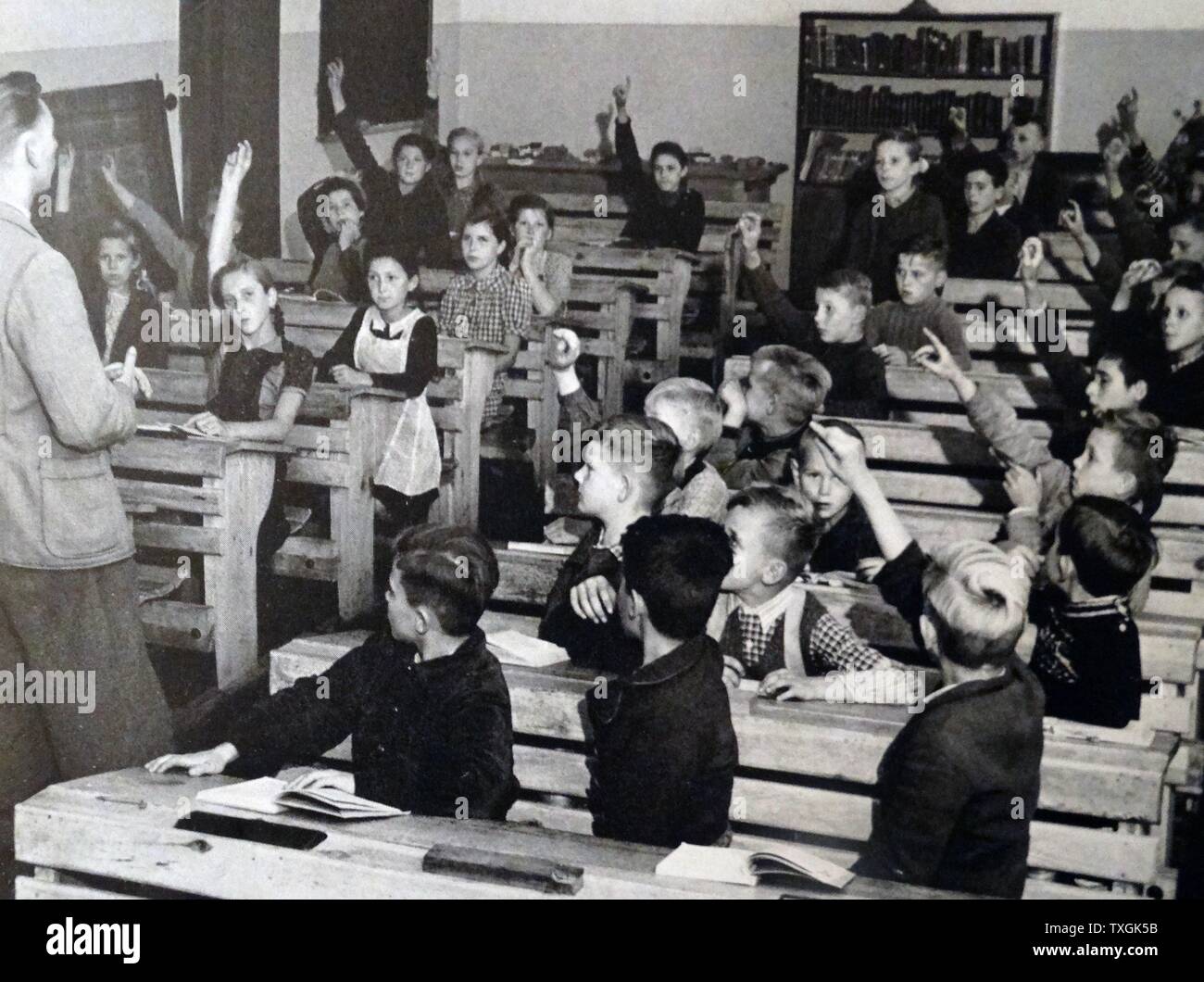 Photographic print of a German classroom post-war with revised ...