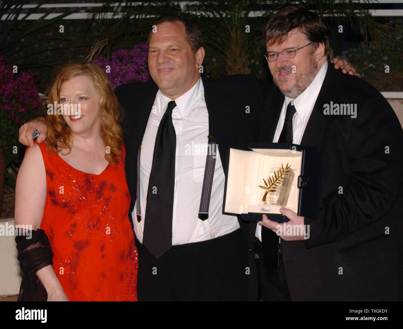 Director Michael Moore(right) poses with his wife Kathleen Glynn and ...