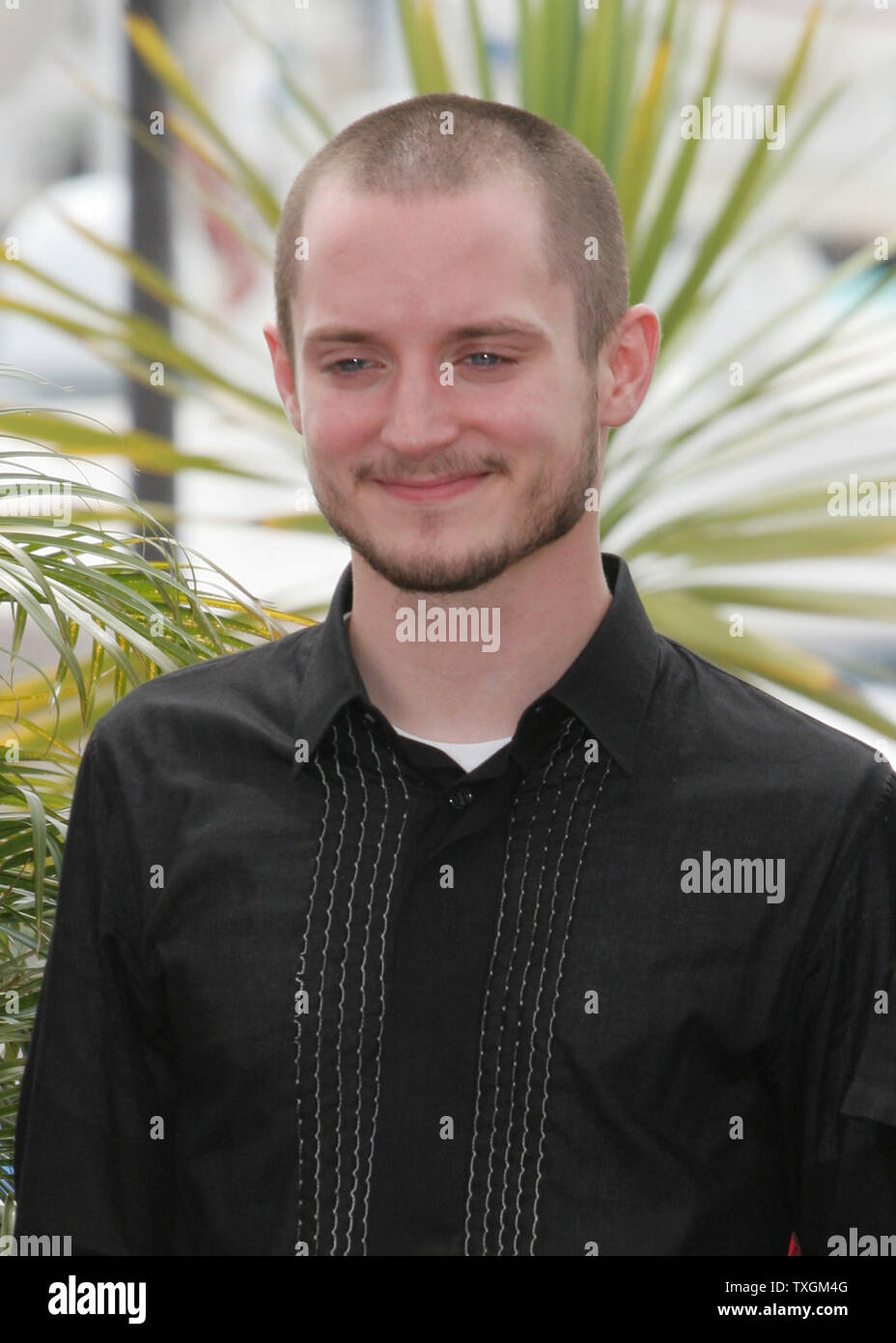 Actor Elijah Wood poses at a photocall for the cast members of "Paris ...