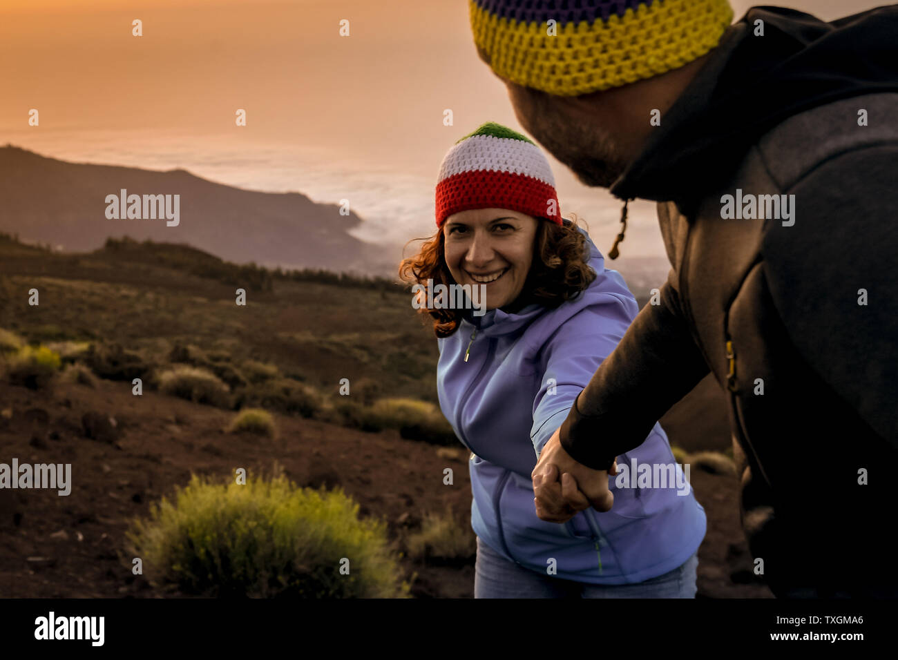 Teamwork couple hiking help other hi-res stock photography and images ...