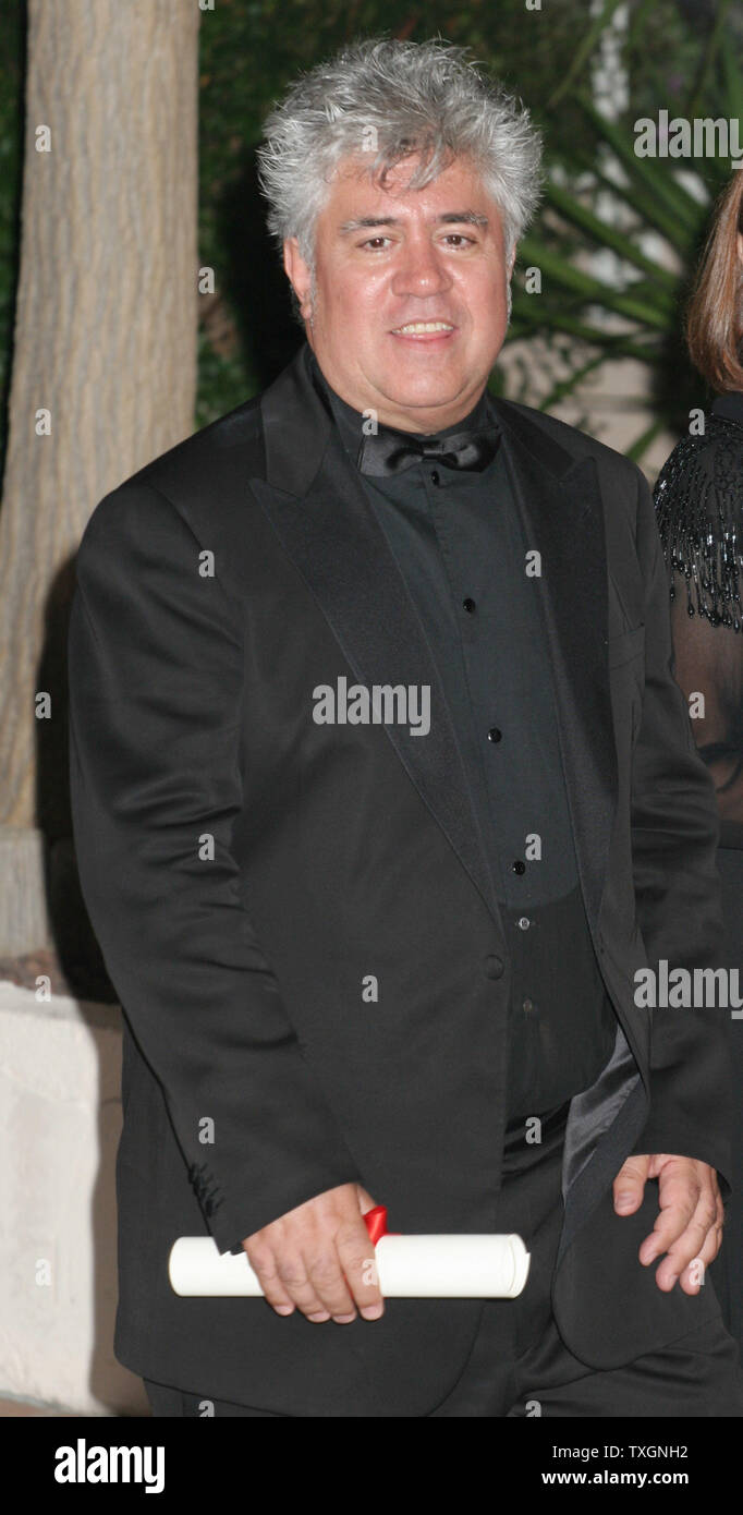 Spanish director Pedro Almodovar displays the Best Screenplay prize for ...