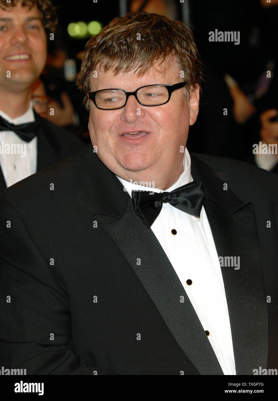 Director Michael Moore arrives at the Palais des Festivals for the gala ...
