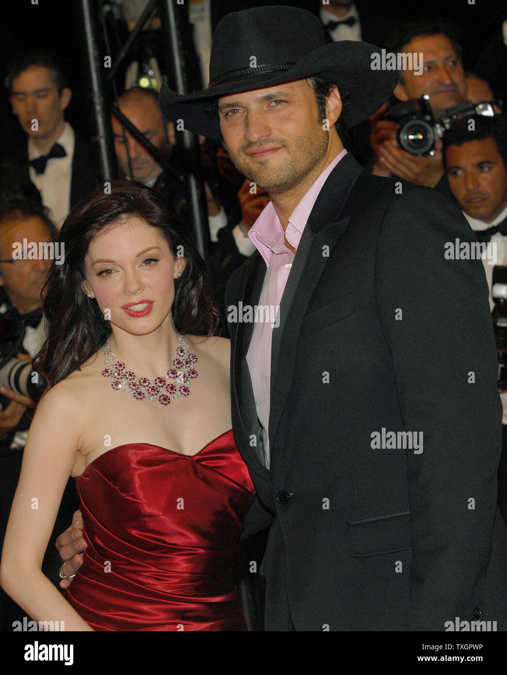 Director Robert Rodriguez (R) and actress Rose McGowan arrive at the ...