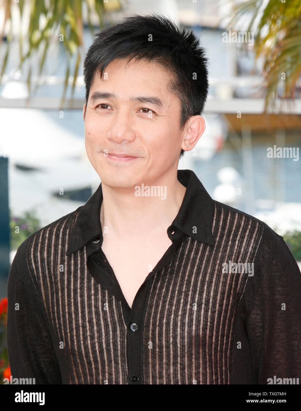 Actor Tony Leung arrives at a photocall for the film "Ashes of Time ...