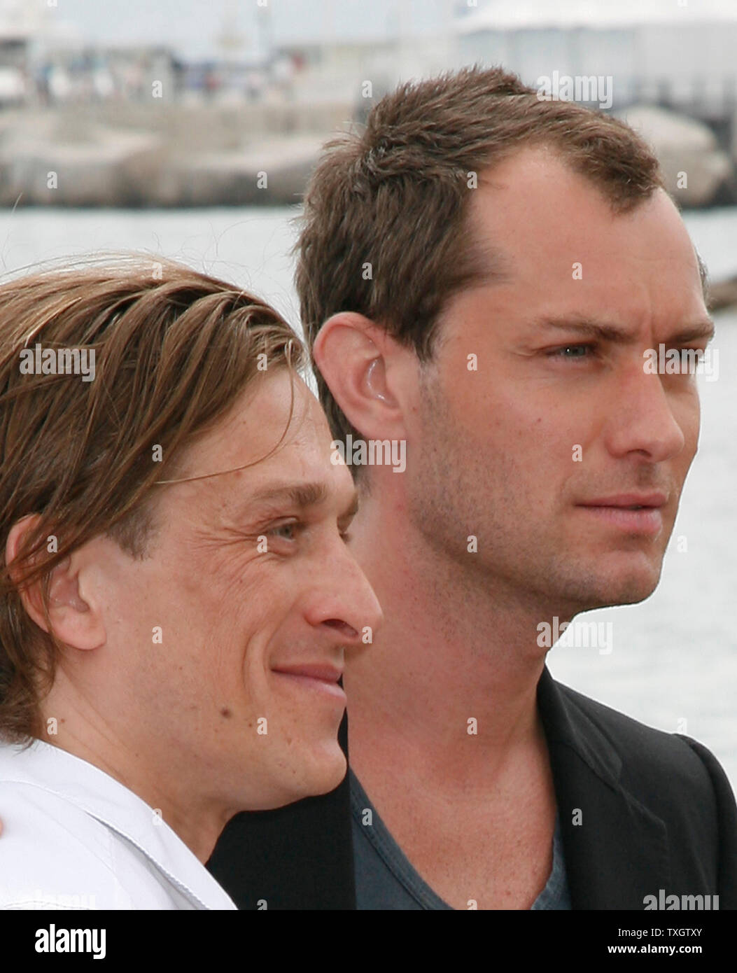 Actor Jude Law (R) and director Jeremy Gilley arrive at a photocall for ...