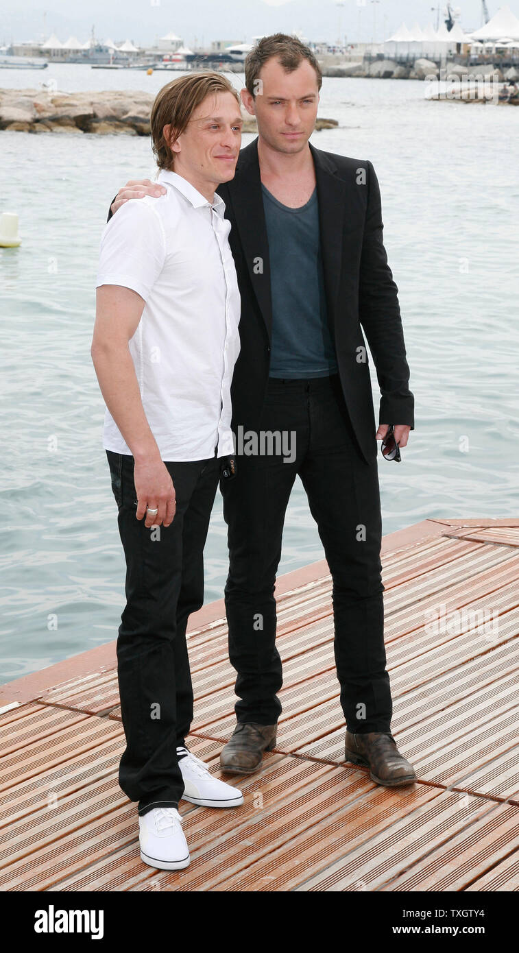 Actor Jude Law (R) and director Jeremy Gilley arrive at a photocall for ...