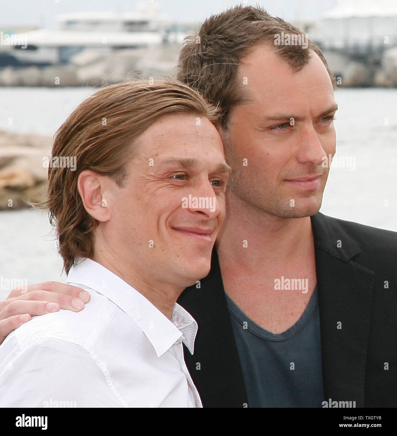 Actor Jude Law (R) and director Jeremy Gilley arrive at a photocall for ...