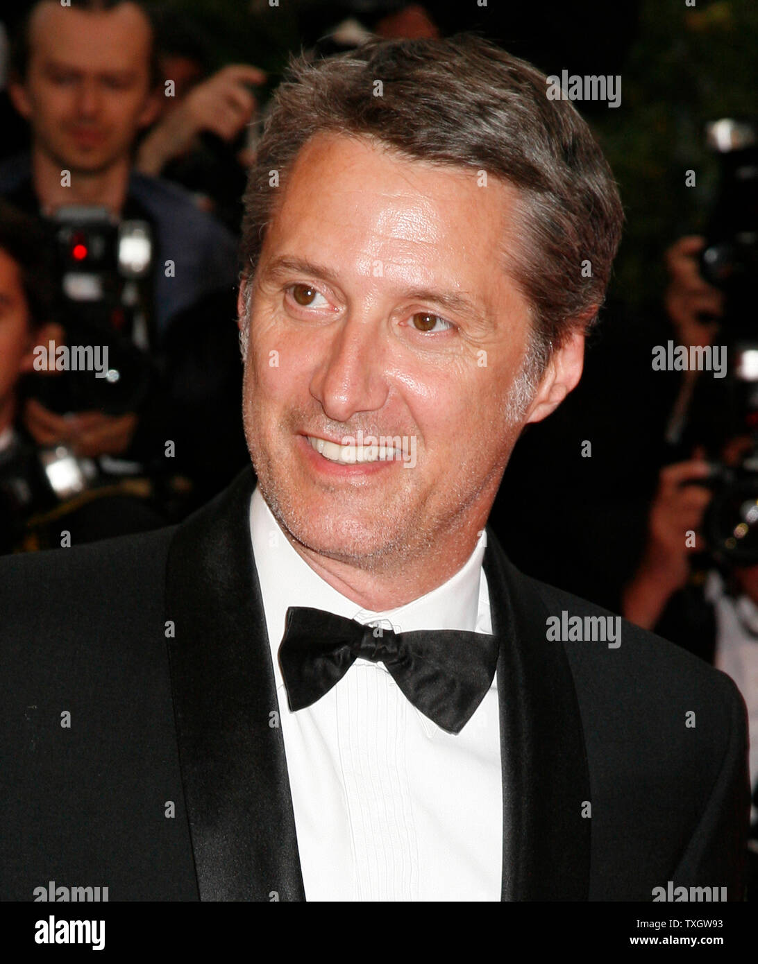 TV presenter Antoine de Caunes arrives on the red carpet before a ...