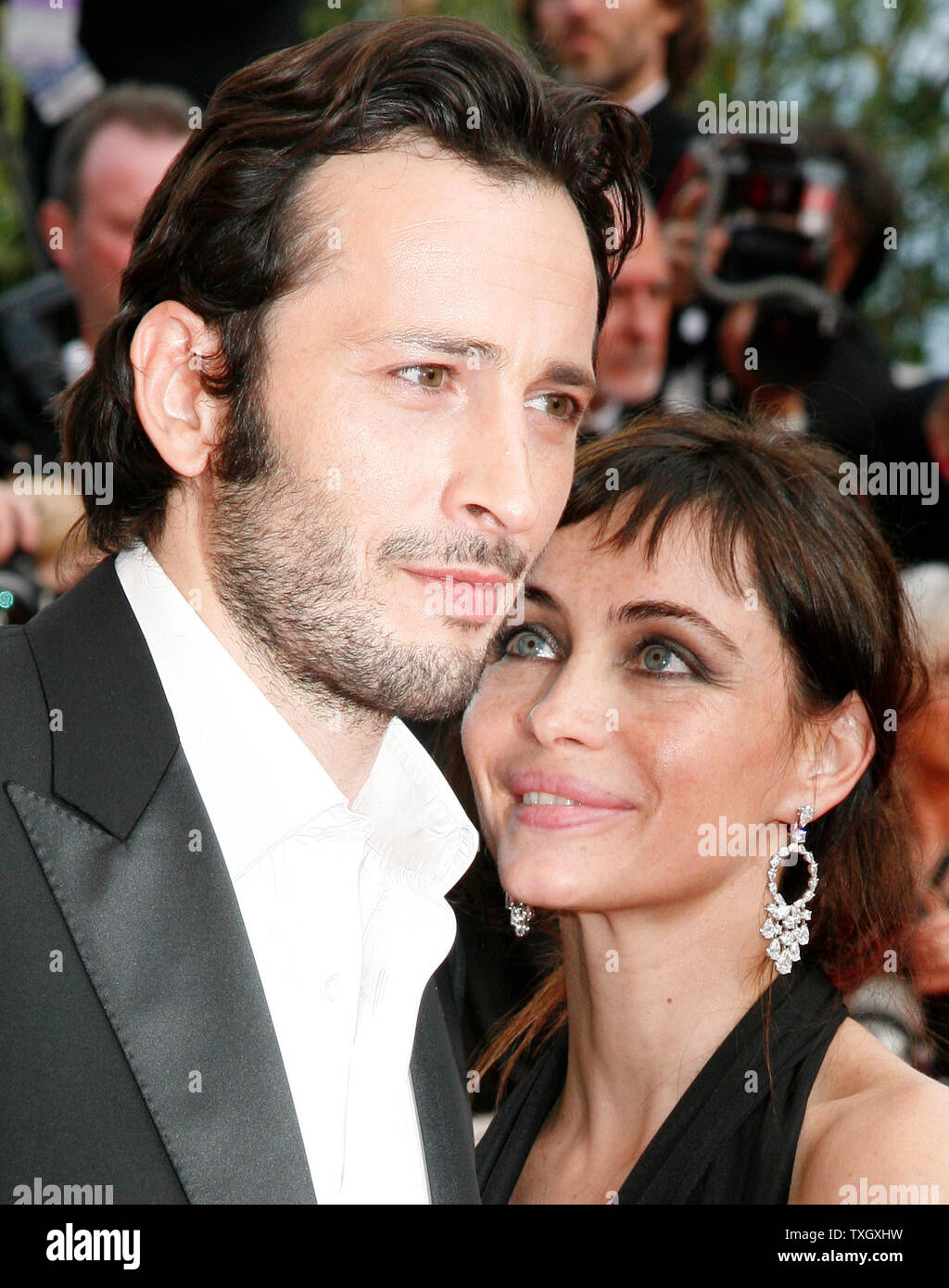 Actress Emmanuelle Beart (R) and guest arrive on the red carpet before ...