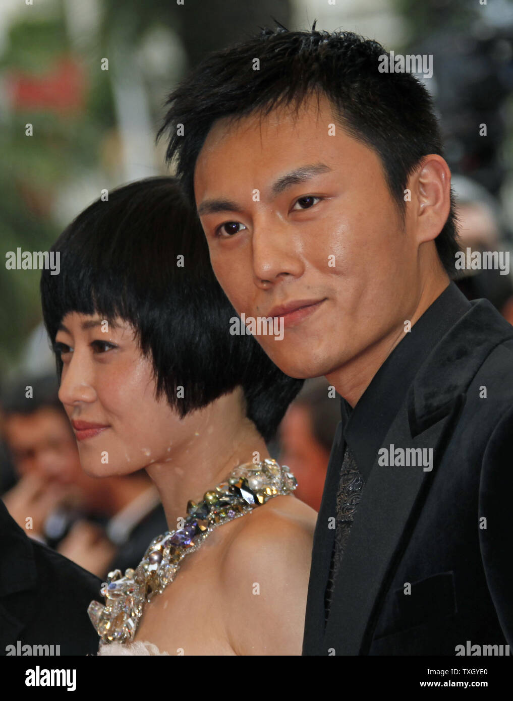 Actress Tan Zhuo and actor Qin Hao arrive on the red carpet before a ...