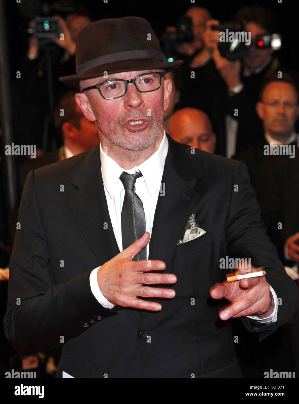 Director Jacques Audiard arrives on the red carpet after a screening of ...