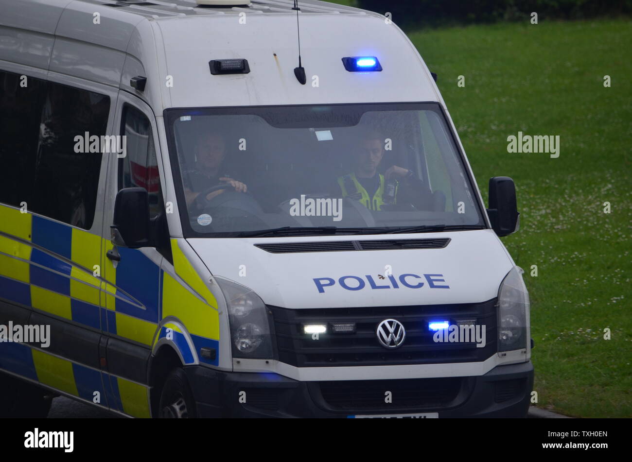 Police van mobile to incident,knife crime Stock Photo - Alamy
