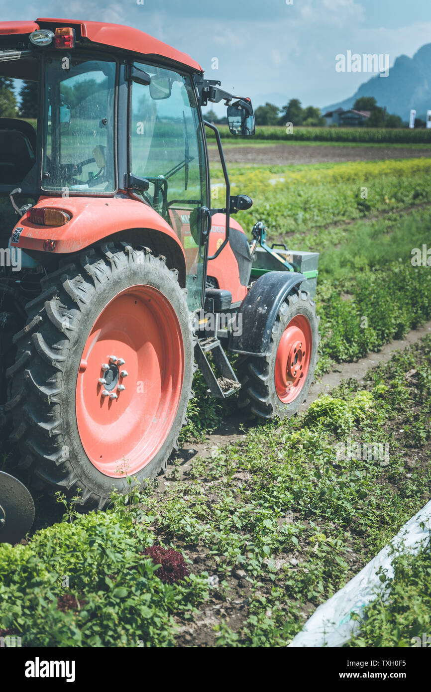 Tractor on an agriculture field, cut out Stock Photo - Alamy