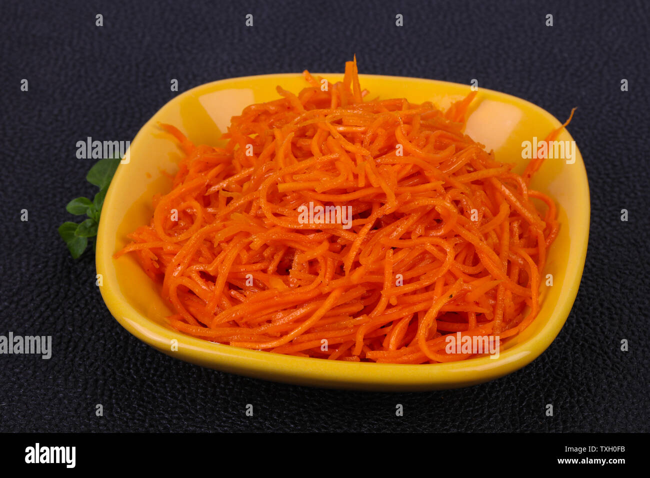 Korean cattot snack salad in the bowl served basil leaves Stock Photo ...