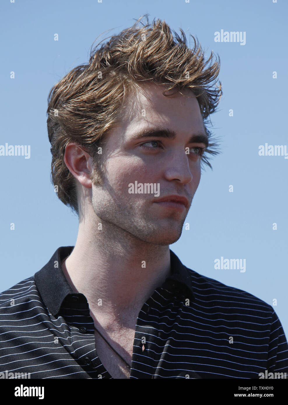 Actor Robert Pattinson arrives at a photocall for the film "The ...