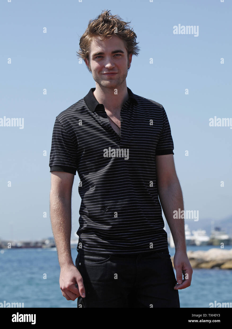 Actor Robert Pattinson arrives at a photocall for the film "The ...