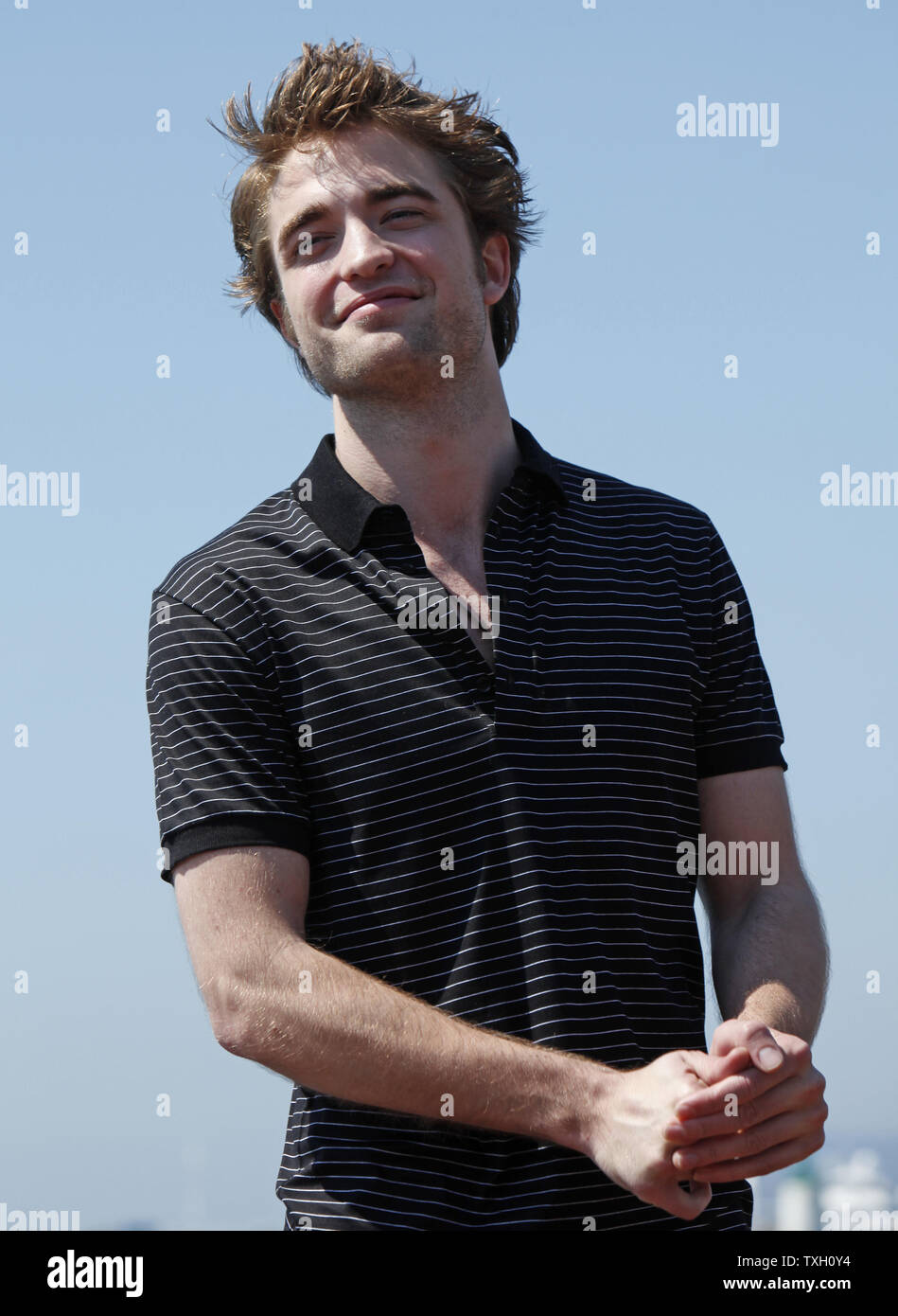 Actor Robert Pattinson arrives at a photocall for the film "The ...