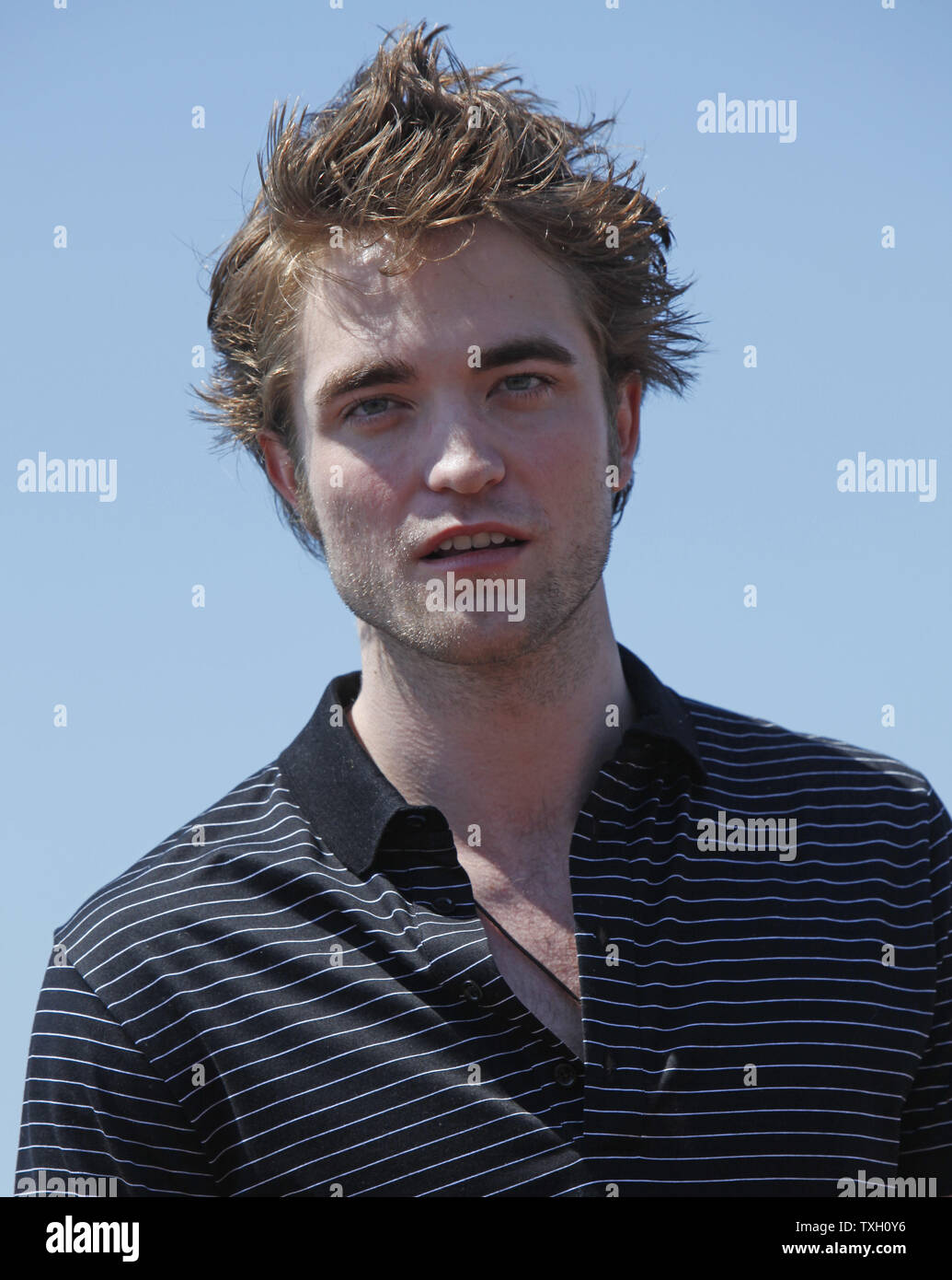 Actor Robert Pattinson arrives at a photocall for the film "The ...
