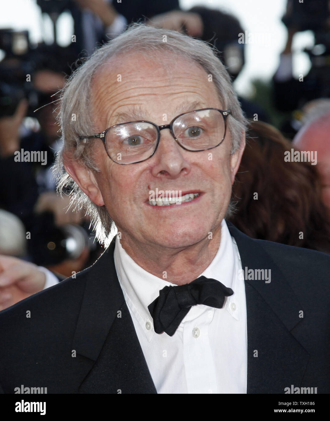 Director Ken Loach arrives on the red carpet before a screening of the ...