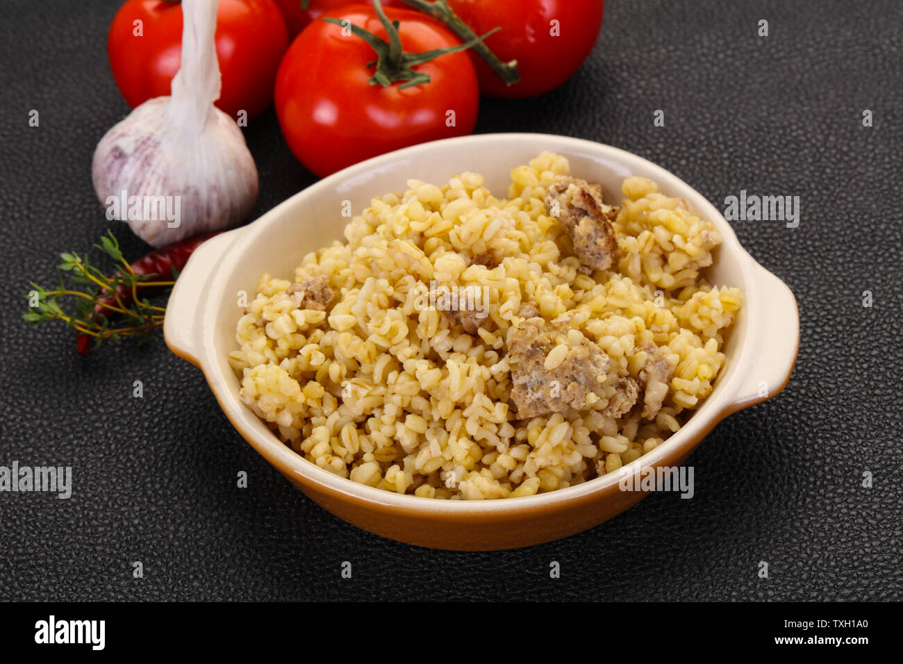 Bulgur with meat and spices Stock Photo - Alamy