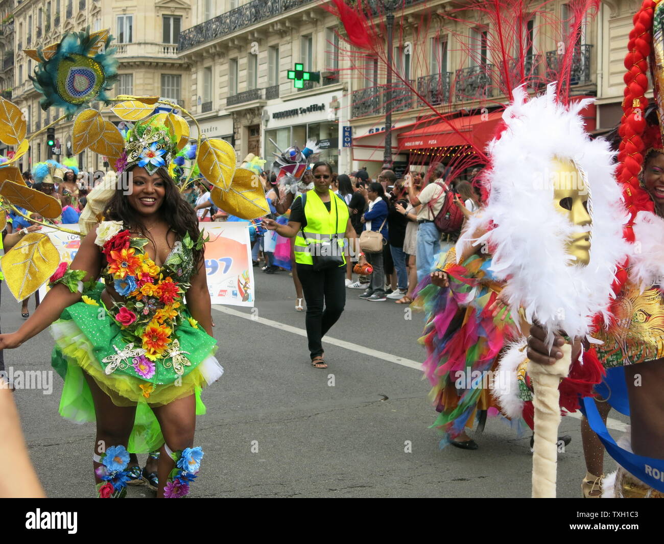 A troupe of female dancers in colourful costume and headdresses at the ...