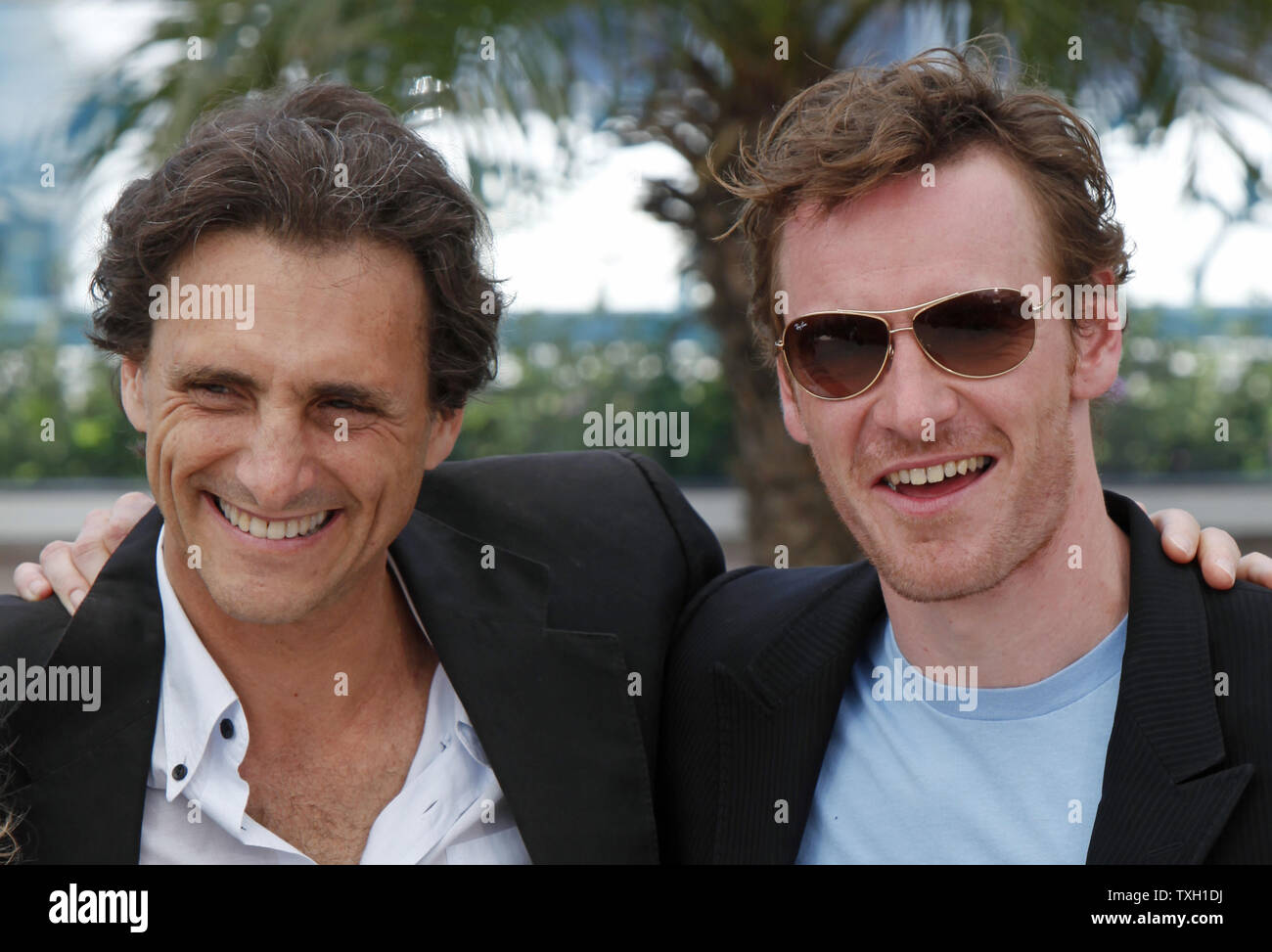 Producer Lawrence Bender (L) and actor Michael Fassbender arrive at a ...