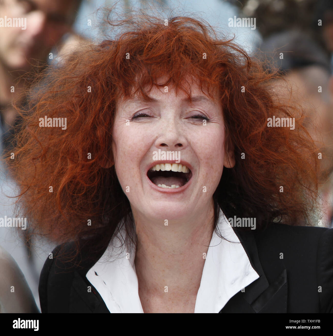 Actress Sabine Azema arrives at a photocall for the film "Les herbes ...