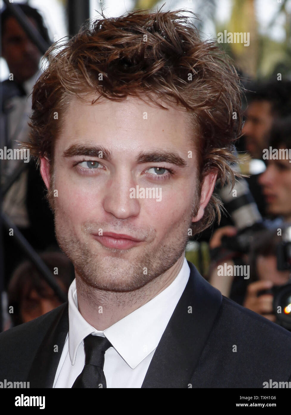 Actor Robert Pattinson arrives on the red carpet before a screening of ...