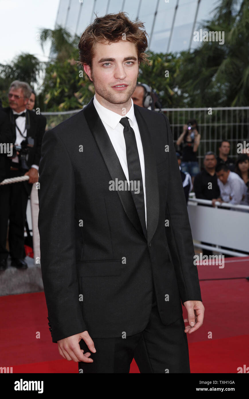 Actor Robert Pattinson arrives on the red carpet before a screening of ...