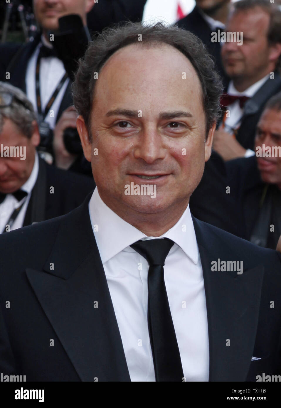 Actor Kevin Pollock arrives on the red carpet before a screening of the ...