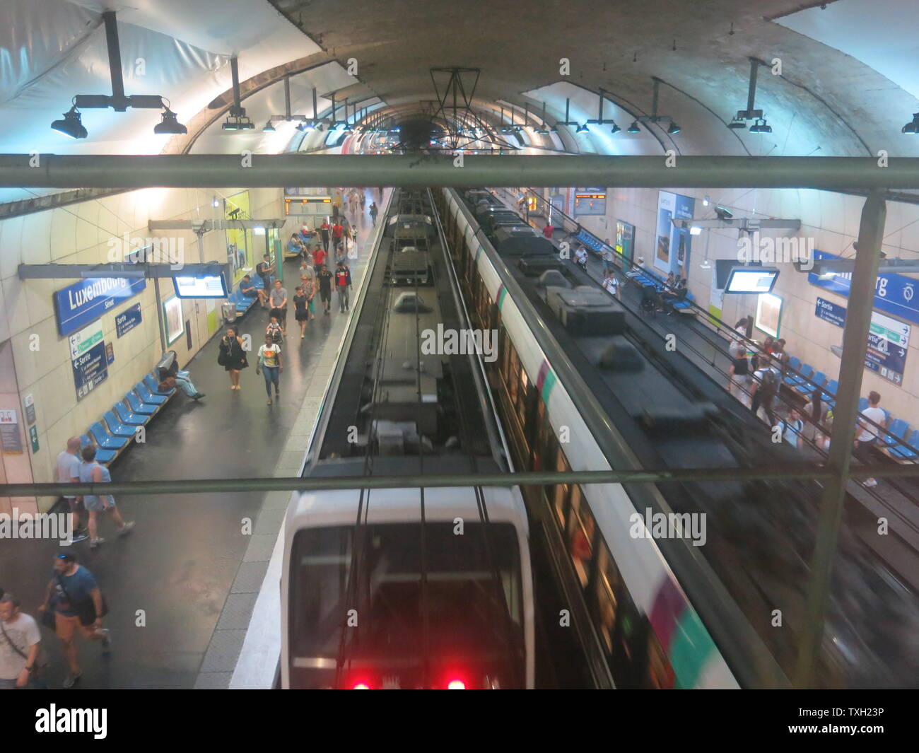 View looking down on two trains at the underground platforms of the ...