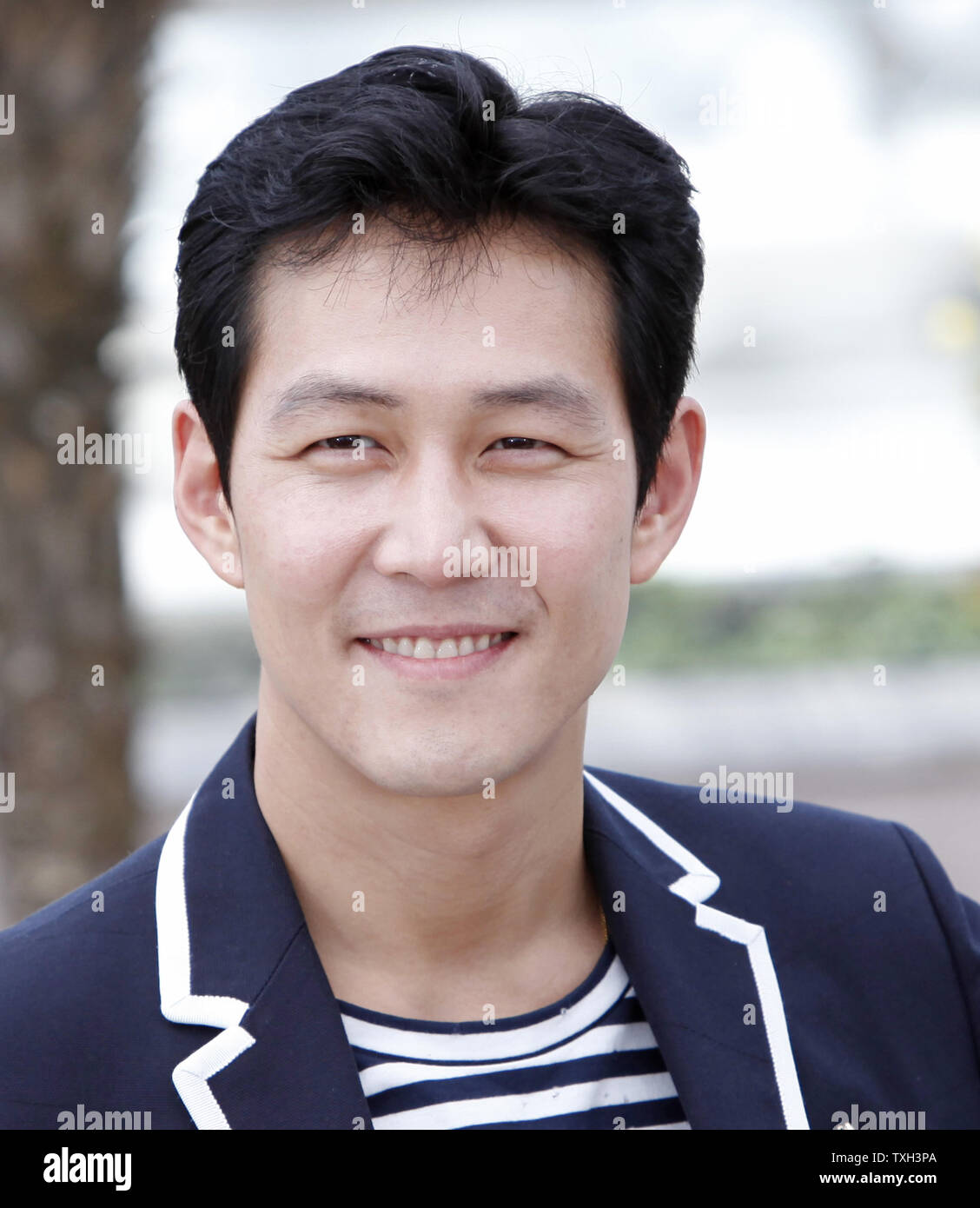 Jung-Jae Lee arrives at a photocall for the film "The Housemaid" at the ...