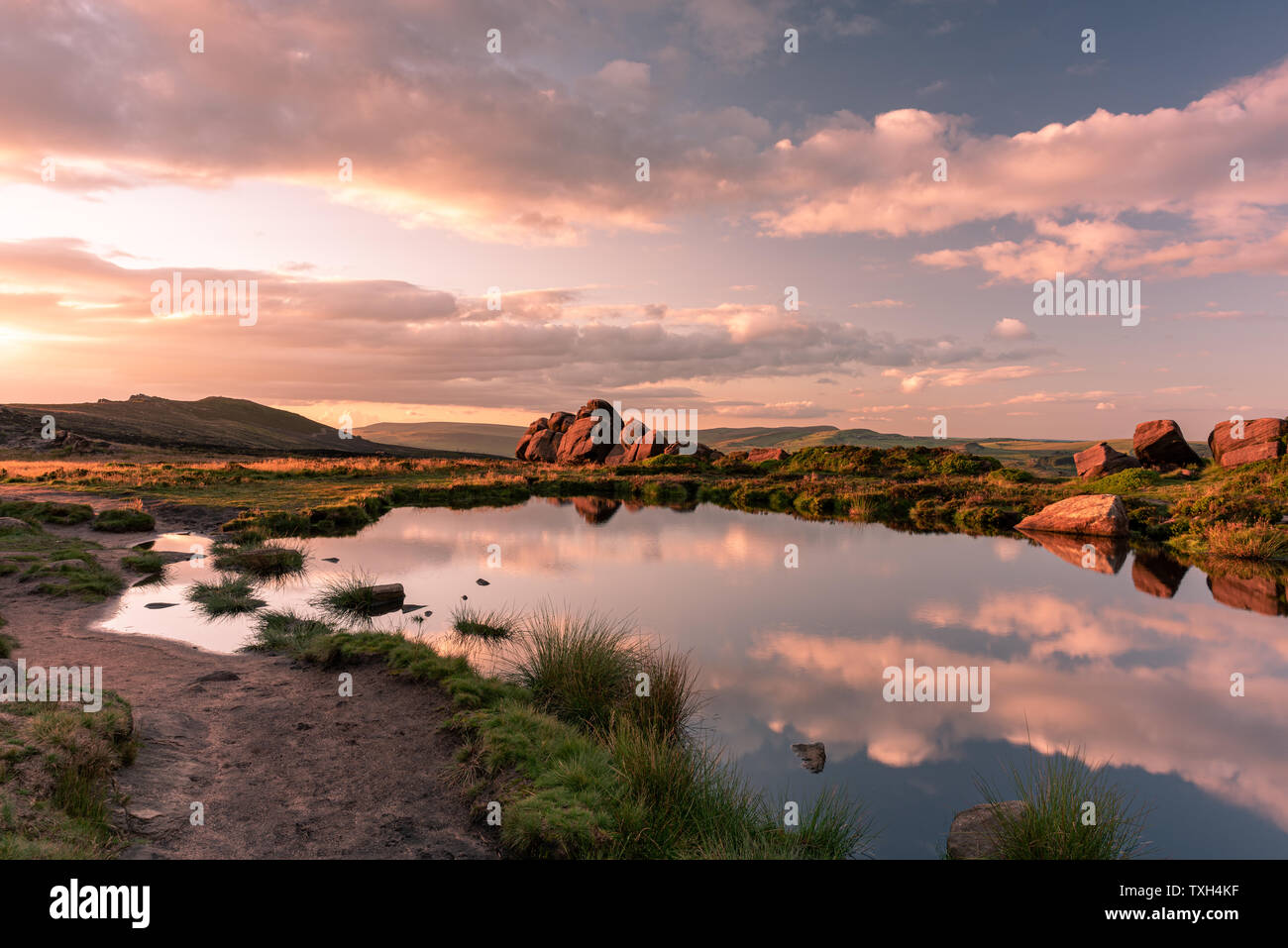Sunset reflections on Doxey Pool at The Roaches, in the Peak District ...