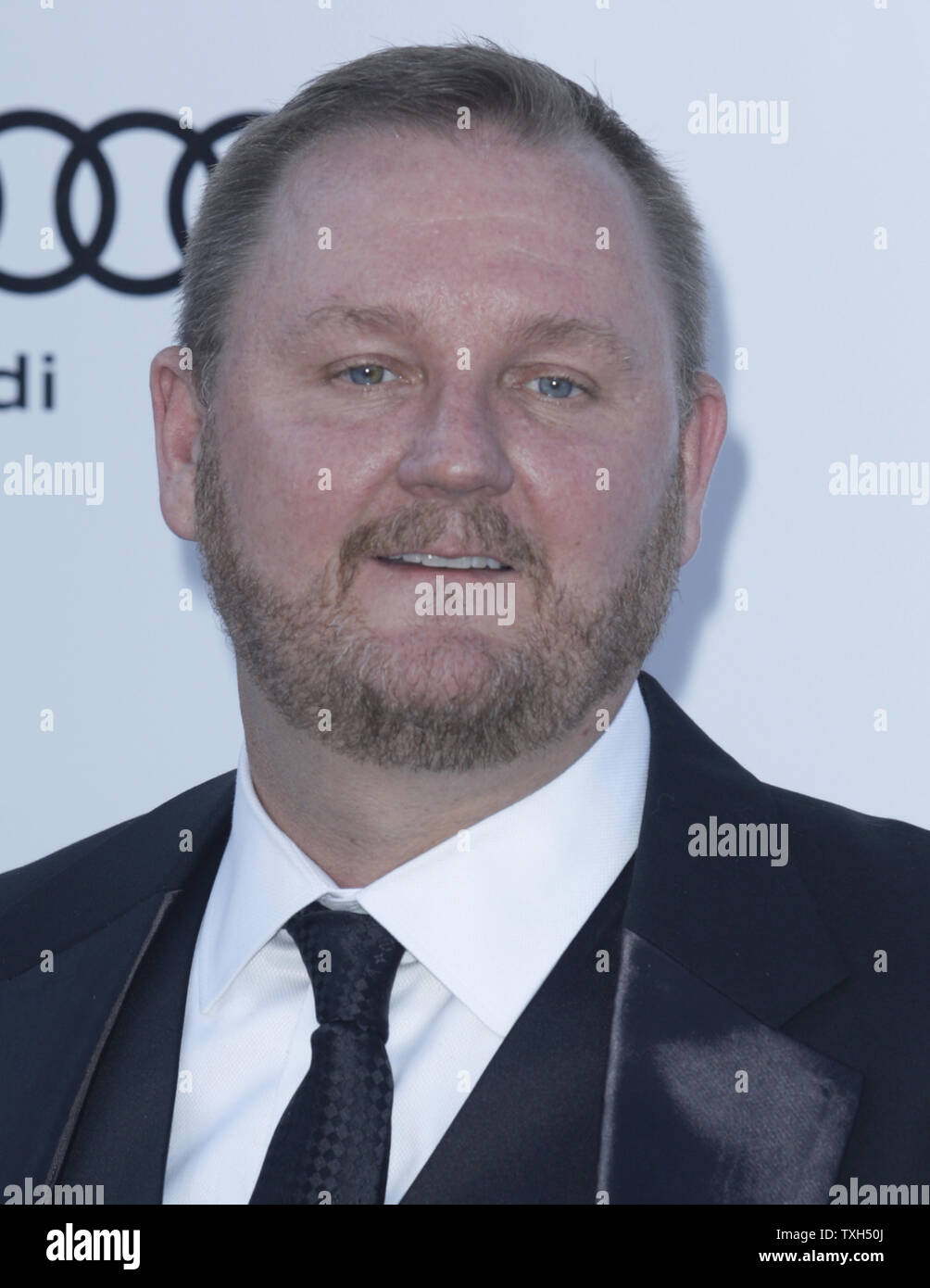 amfAR CEO Kevin Frost arrives on the red carpet at the amfAR Cinema ...