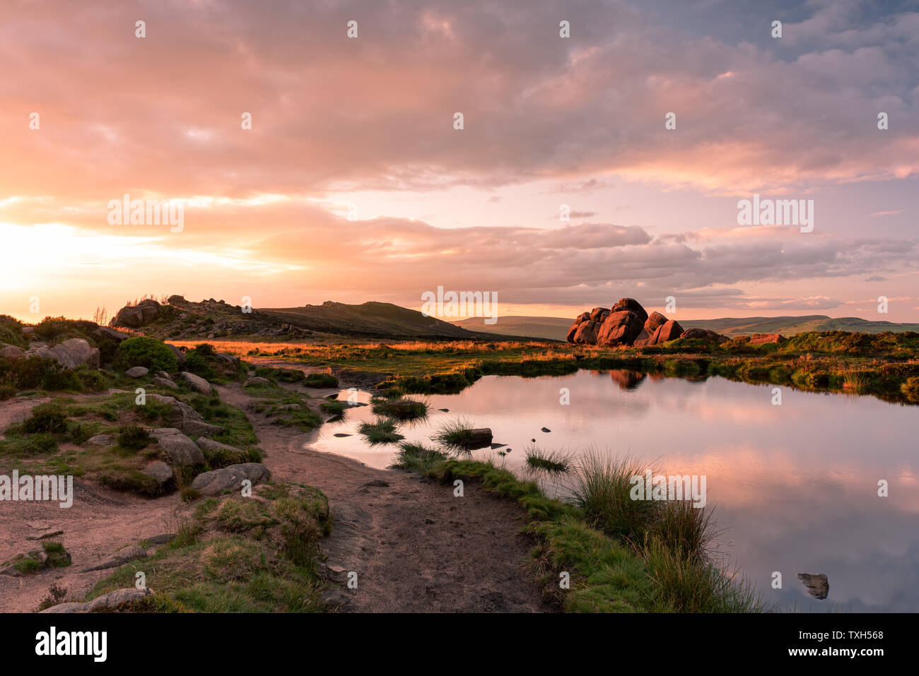 Sunset reflections on Doxey Pool at The Roaches, in the Peak District ...