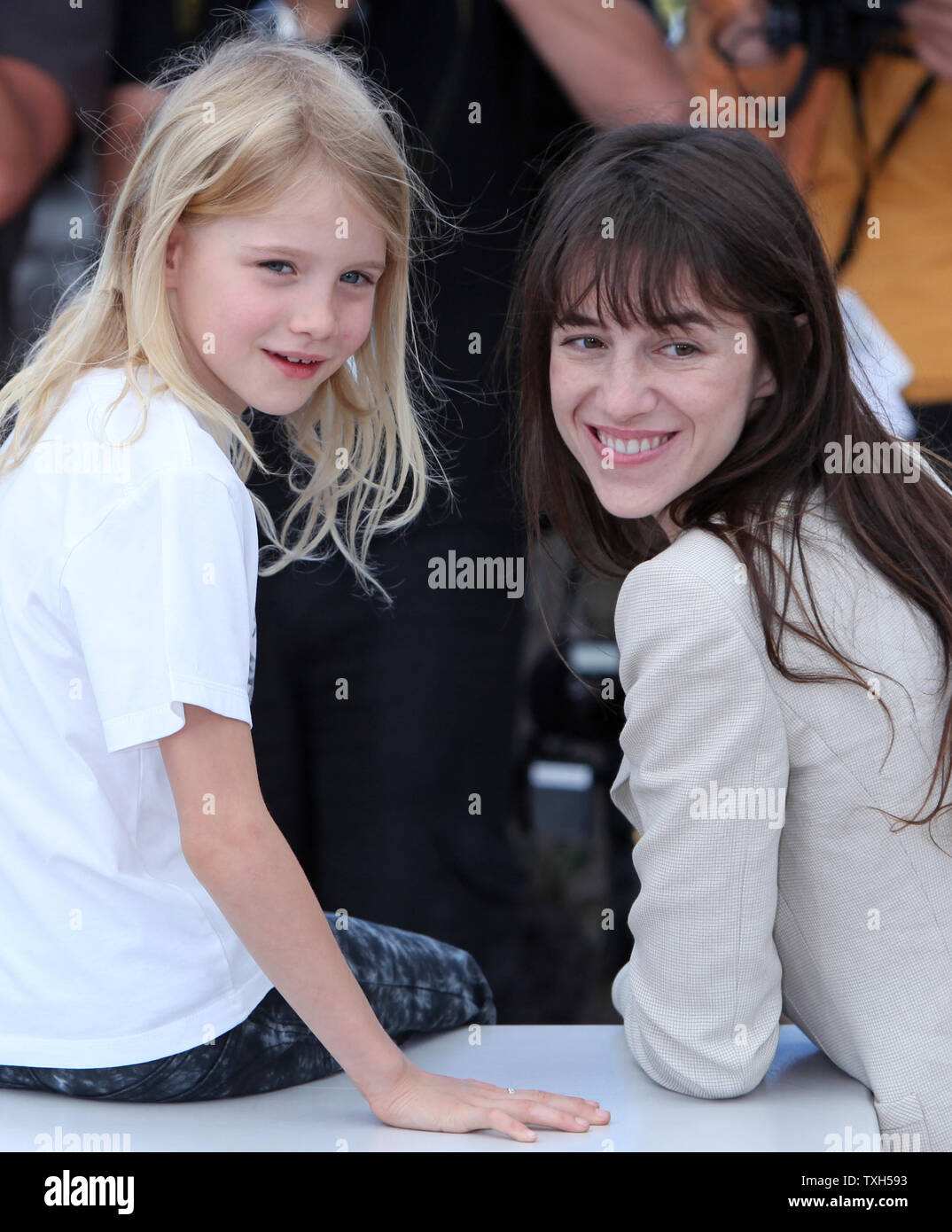 Morgana Davies (L) and Charlotte Gainsbourg arrive at a photocall for ...