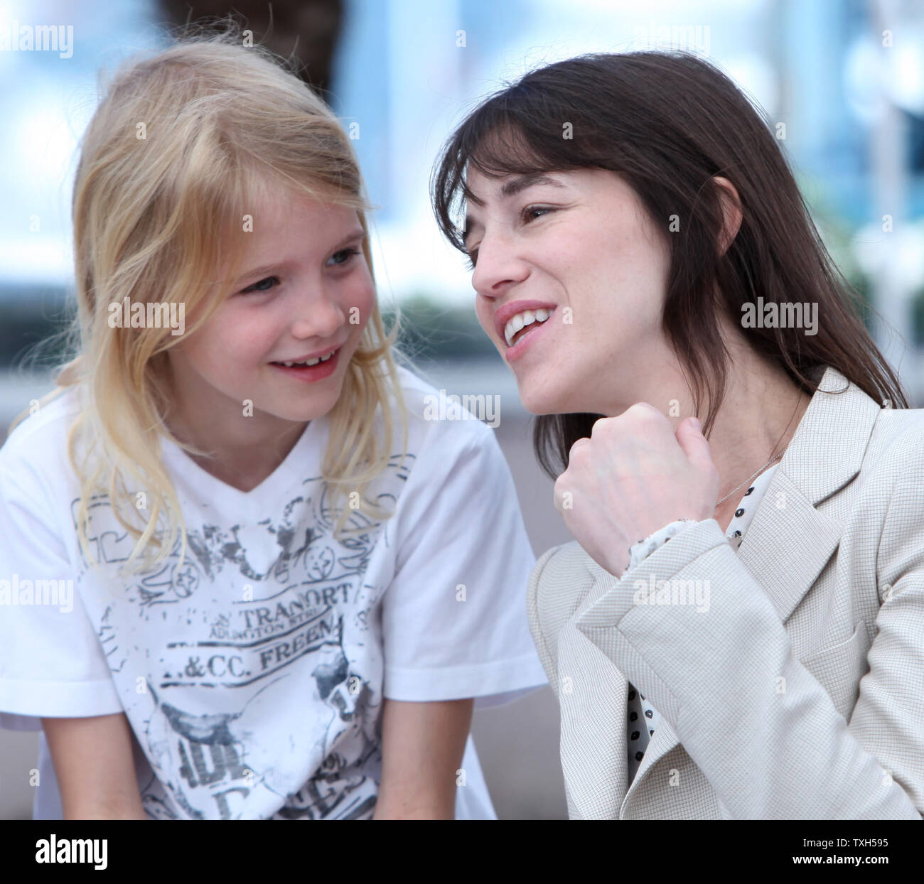 Morgana Davies (L) and Charlotte Gainsbourg arrive at a photocall for ...