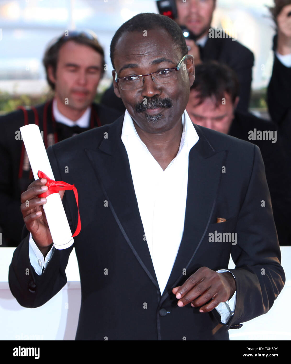 Mahamat-Saleh Haroun arrives at the awards photocall after winning the ...