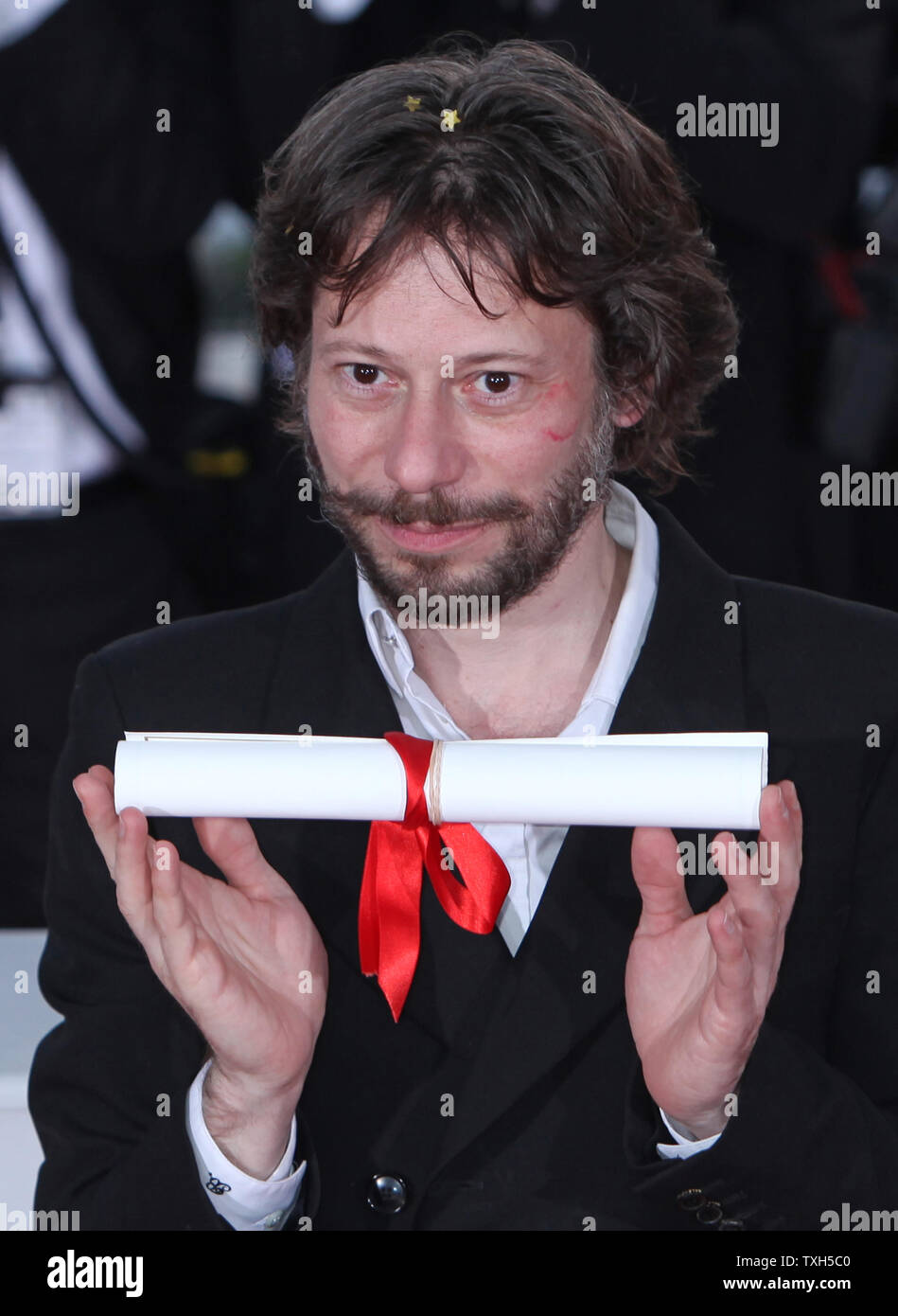 Mathieu Amalric arrives at the awards photocall after winning the Best ...