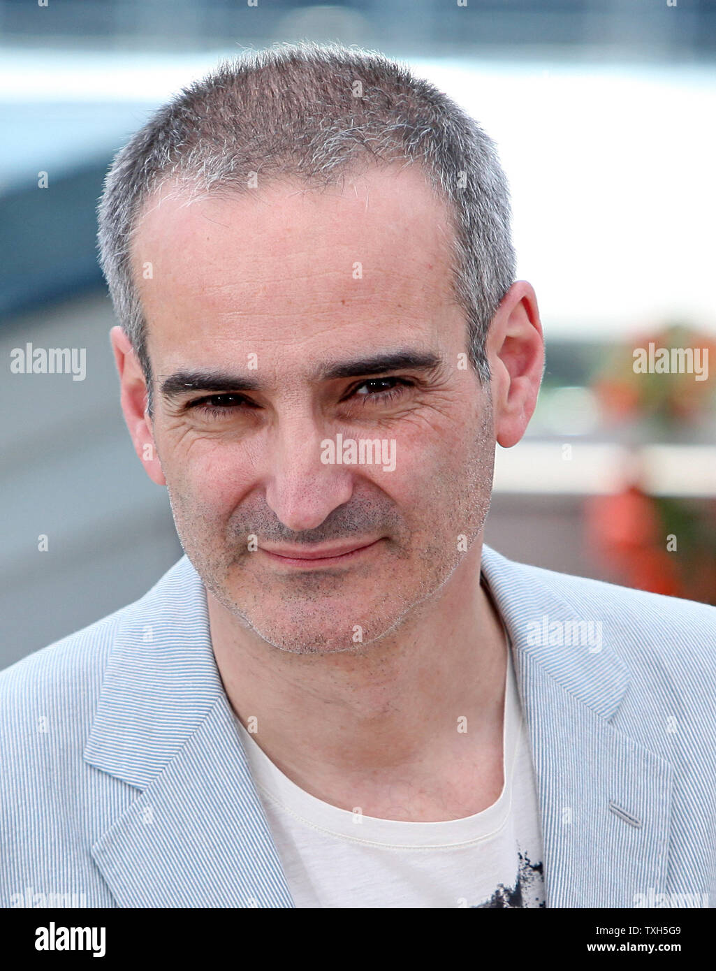Oliver Assayas arrives for a jury photocall at the 64th annual Cannes ...