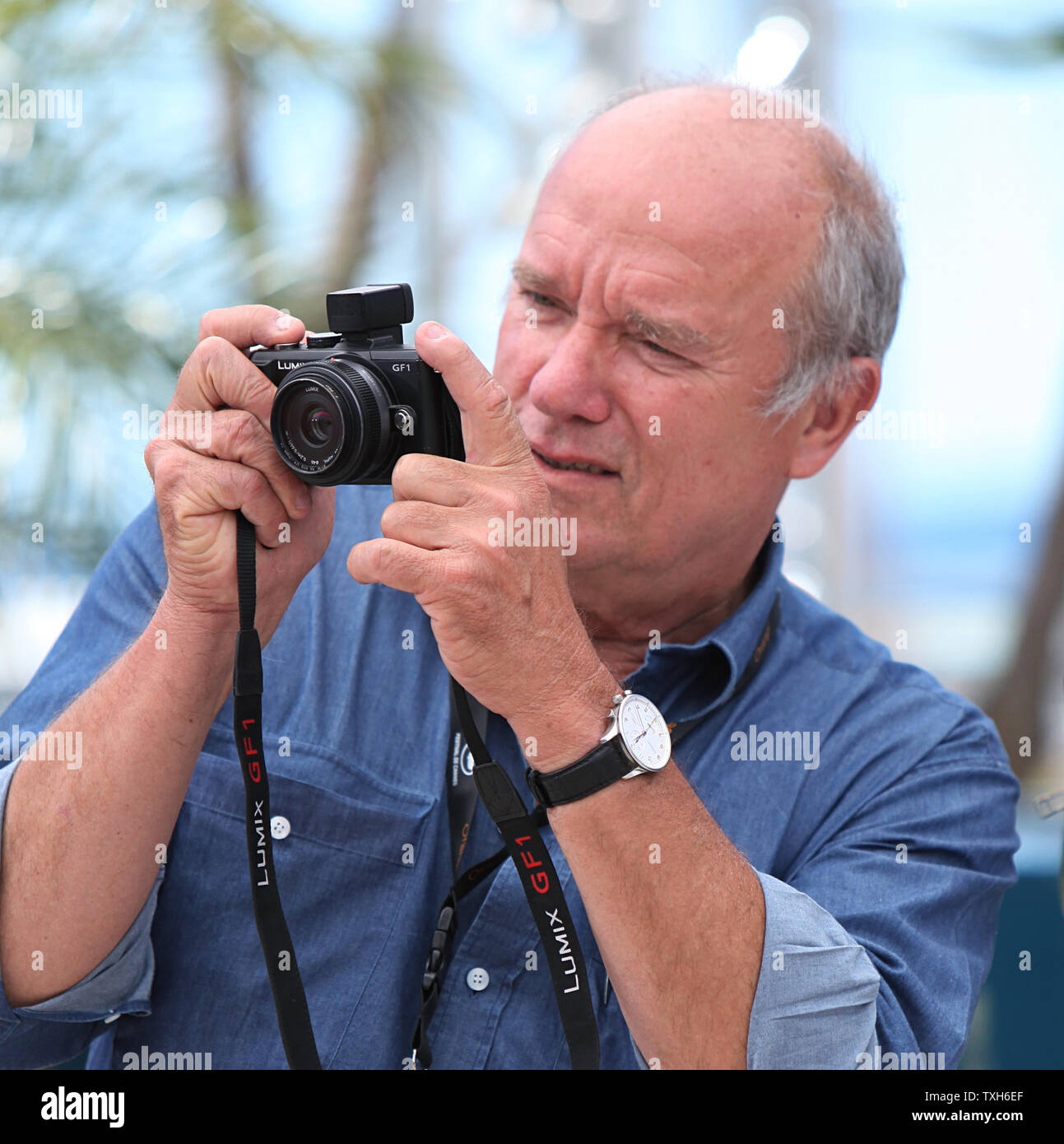 Peter Lindbergh takes a photo during a photocall for the film "The Look ...