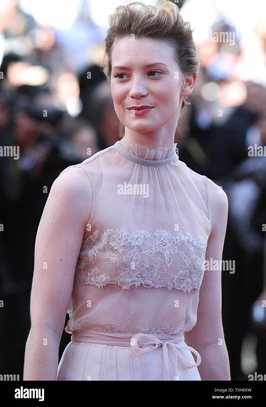 Mia Wasikowska arrives on the red carpet before the screening of the ...