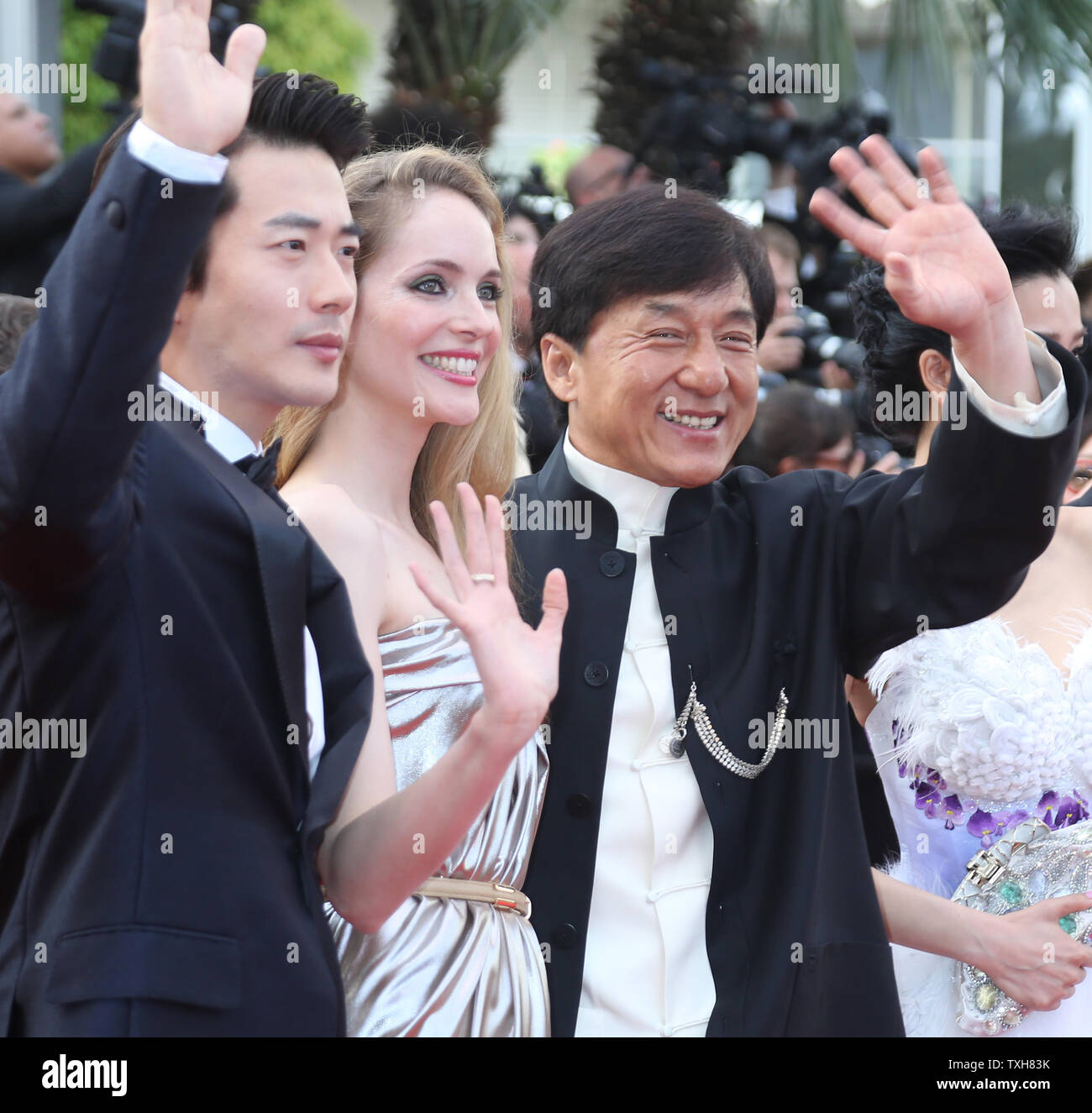 Jackie Chan (R) and guests arrive on the red carpet before the ...